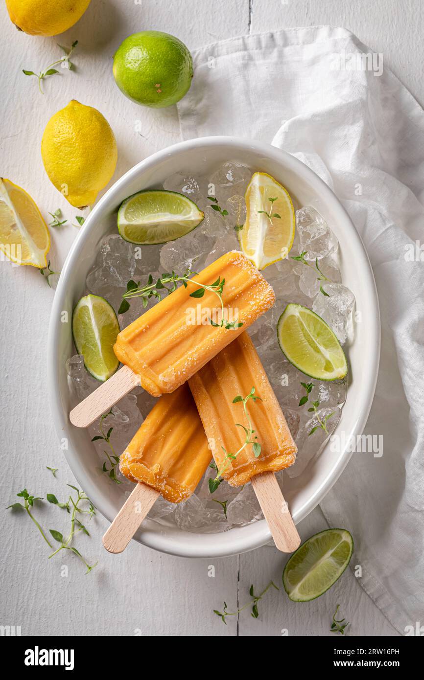 Sweet ice cream sorbet made of lemons and limes. Yellow sorbet with a ...
