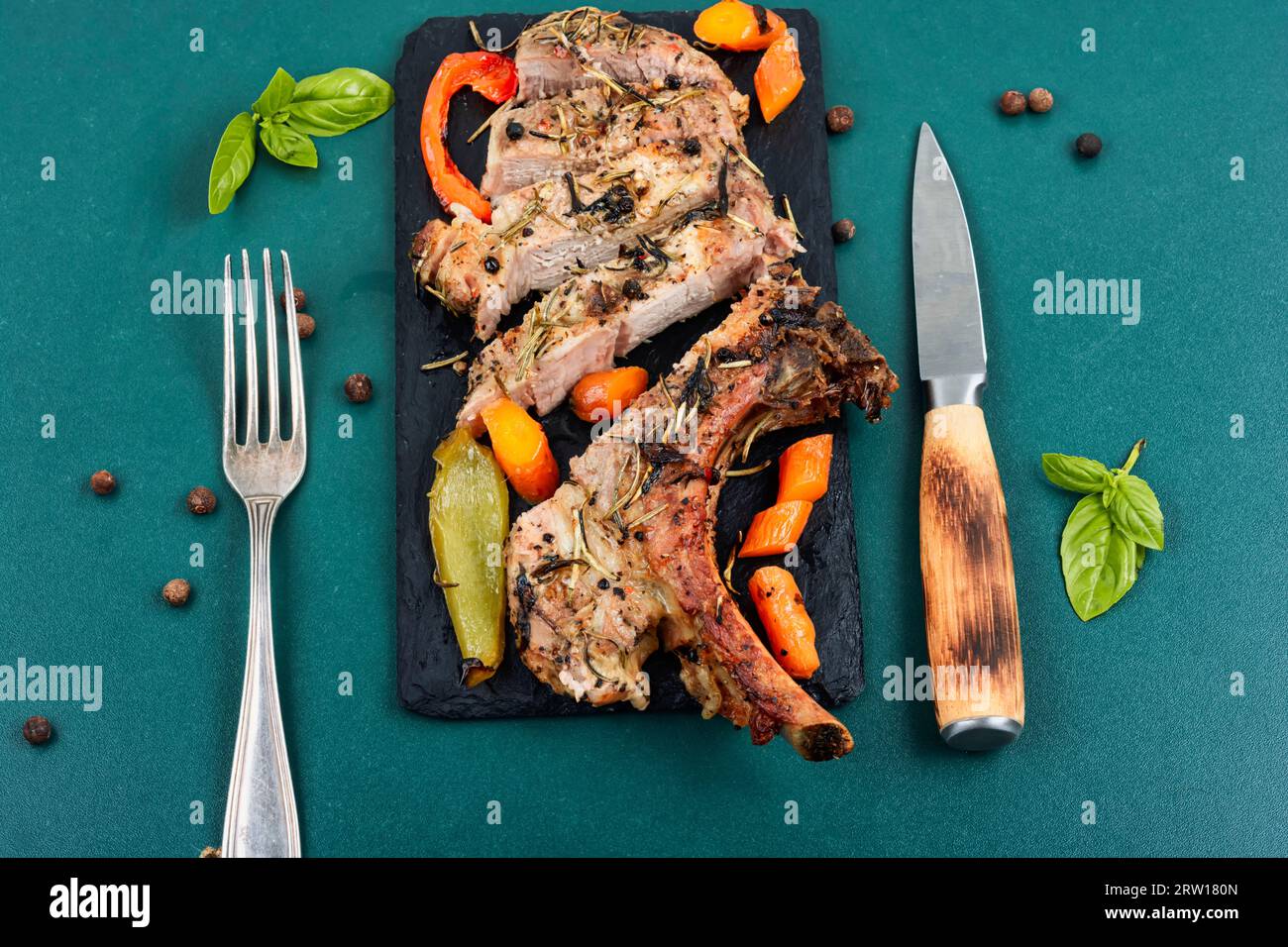 Sliced grilled pork chop tomahawk meat steak Stock Photo - Alamy