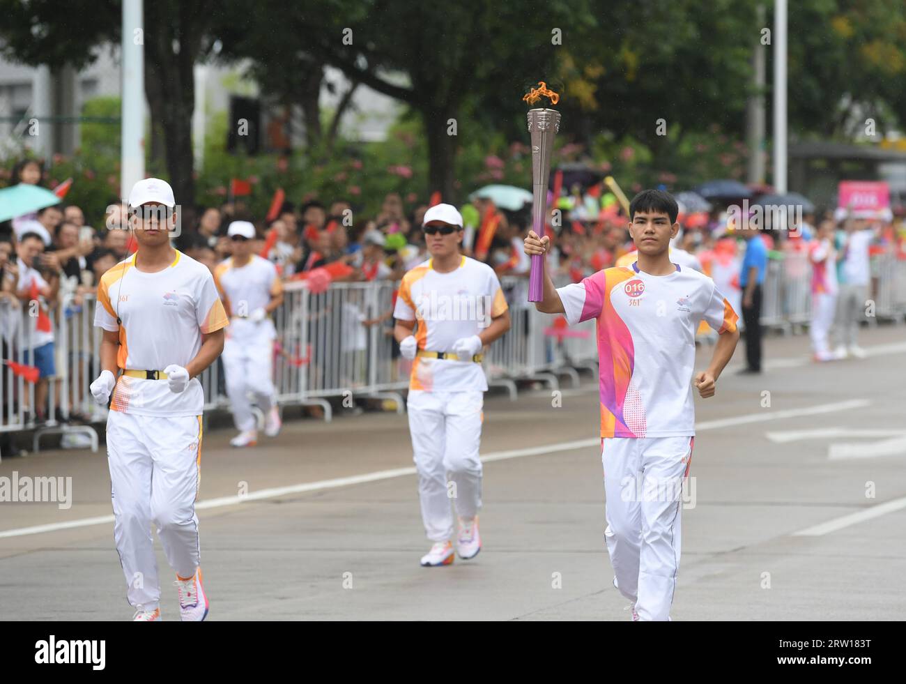 Lishui, China's Zhejiang Province. 16th Sep, 2023. Torch bearer Chen Jiawei runs with the torch ...