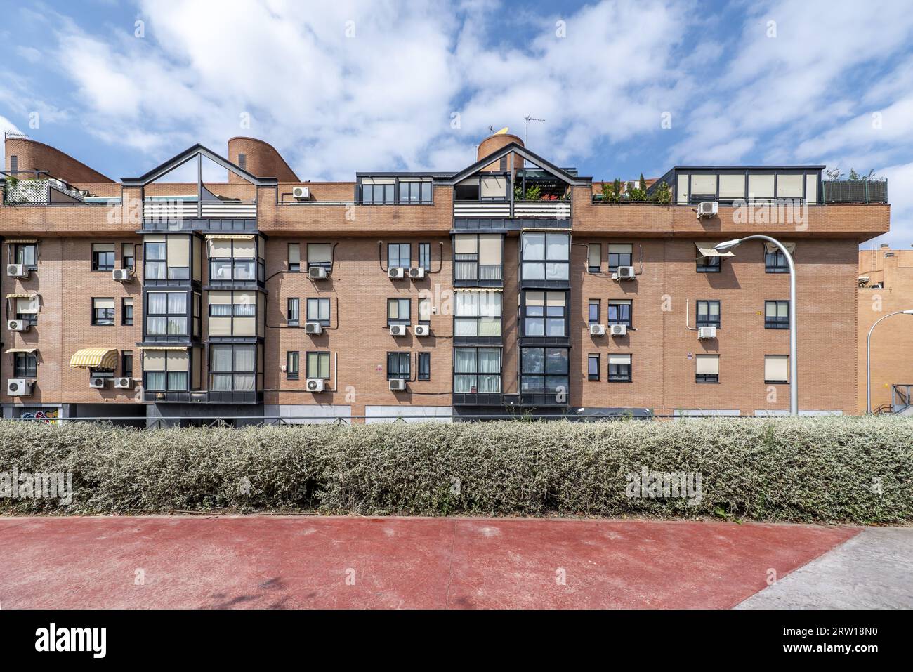 Facades of residential buildings with homes in the attics and black ...