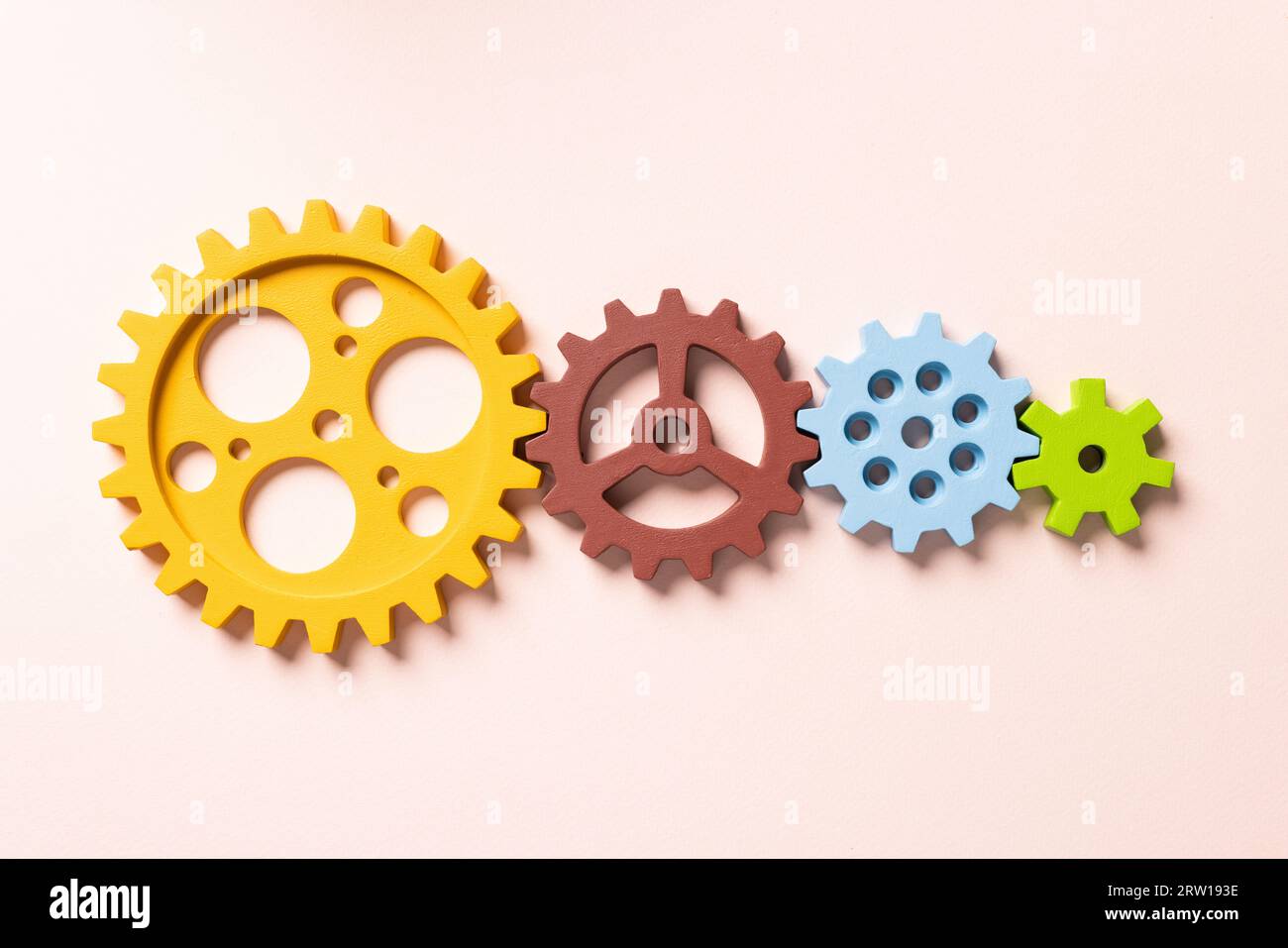 Teamwork gear hand puzzle hi-res stock photography and images - Alamy