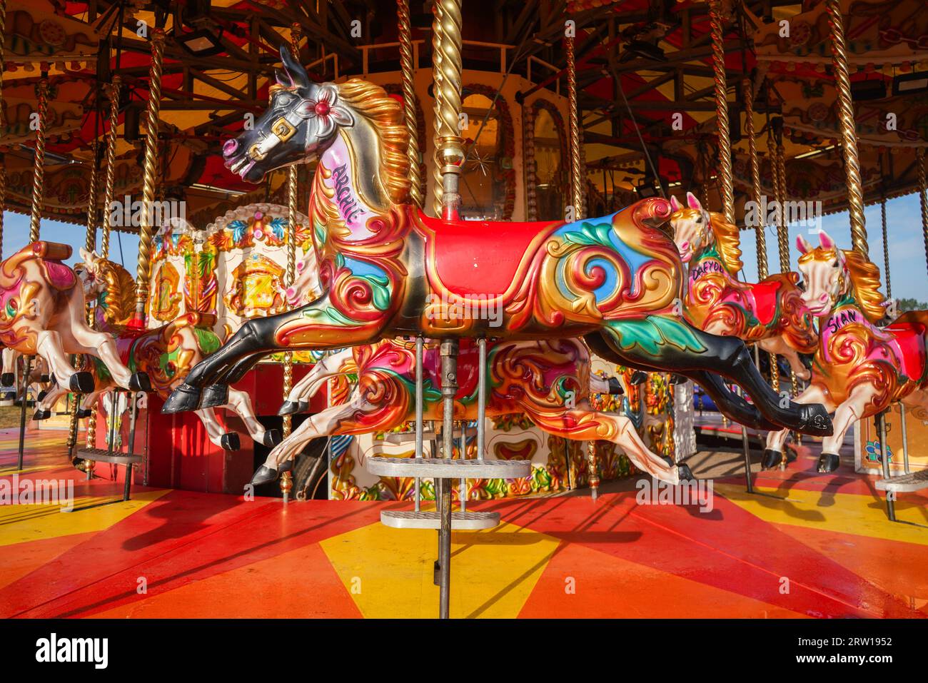 Carousel horses on a roundabout at fun fair, London, UK Stock Photo - Alamy