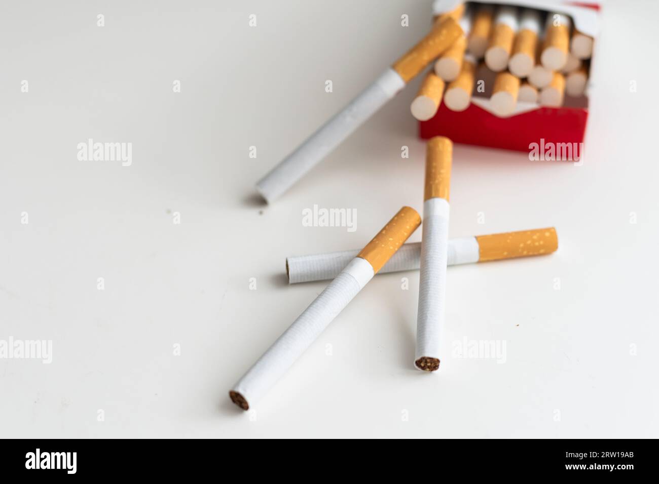 Heap of cigarettes. Isolated on a white background Stock Photo - Alamy