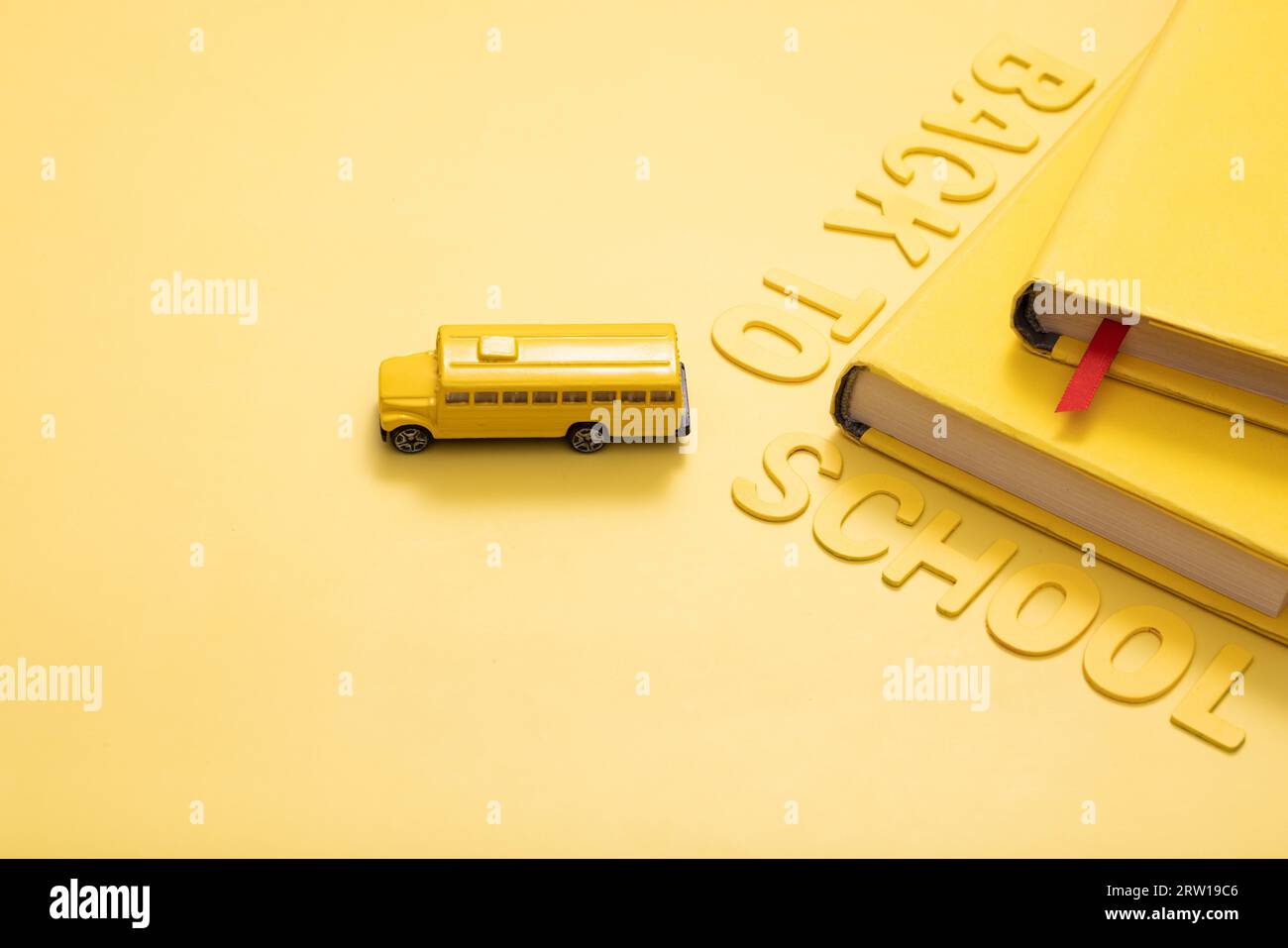 Yellow school bus with books and an inscription back to school. concept ...
