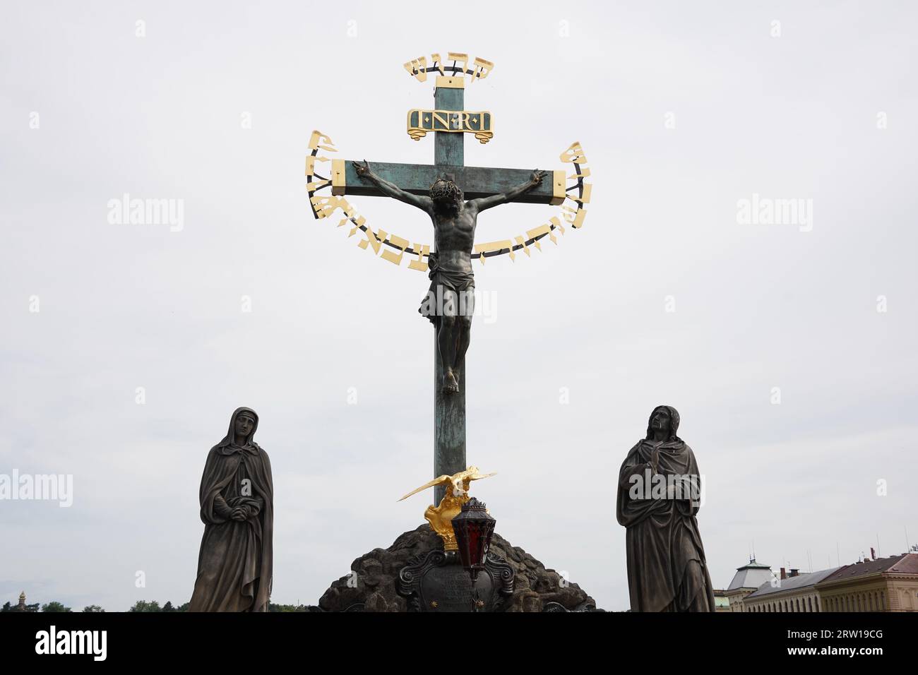 A statue of the holy crucifix on the historic Charles Bridge in Prague ...