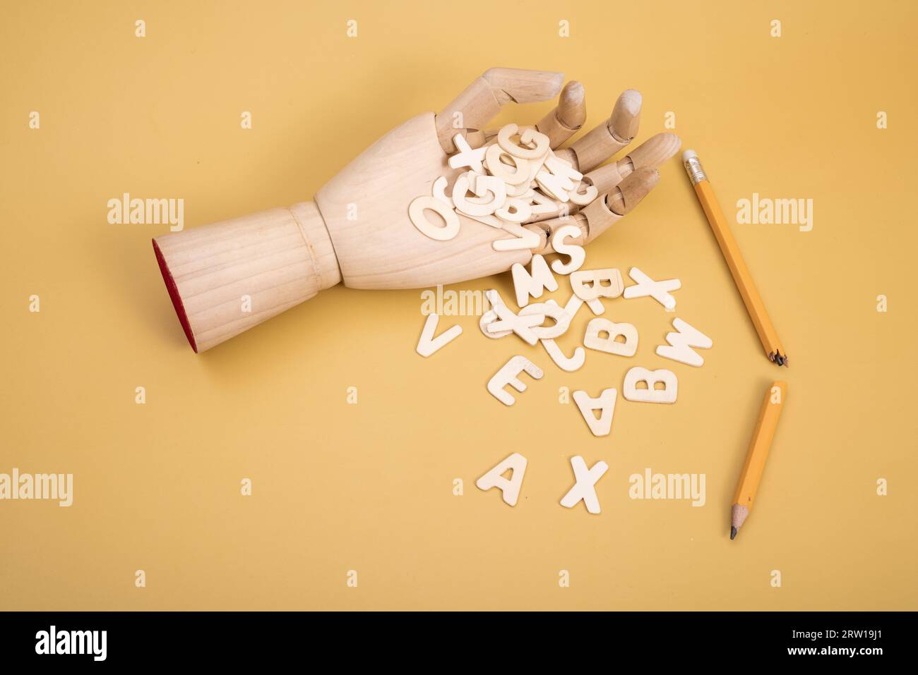 Wooden hand with pencil and wooden letters. High quality photo Stock ...