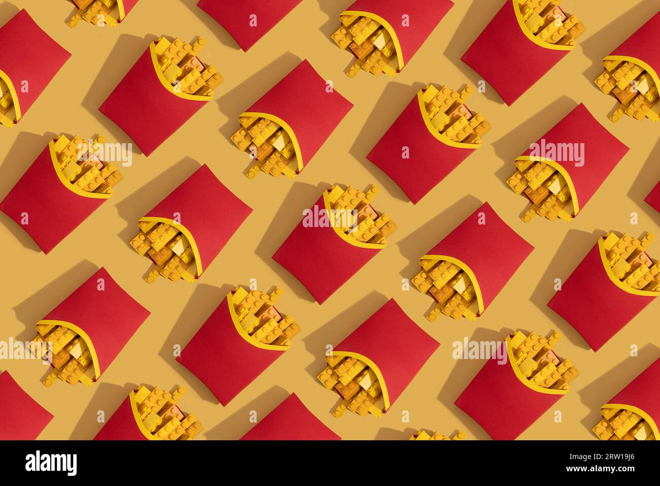 french fries made of lego bricks on a colored background, plastic ...
