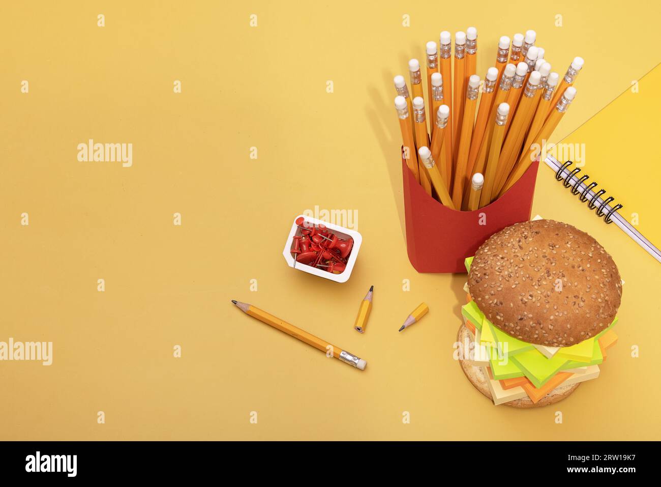 hamburger and fries made from lego bricks on color background, plastic ...