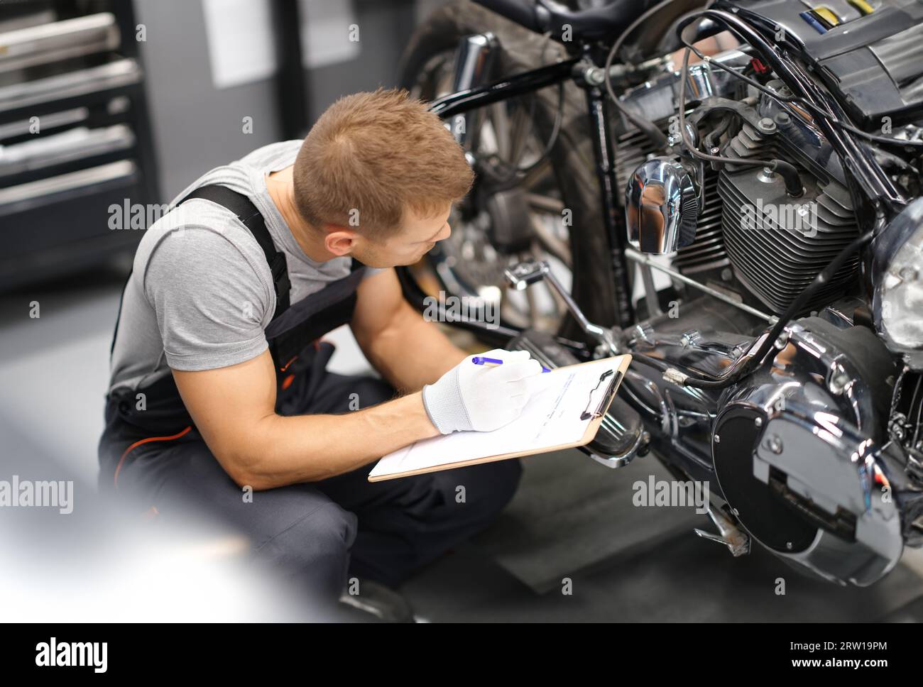 Male mechanic diagnoses parts on hi-res stock photography and images ...
