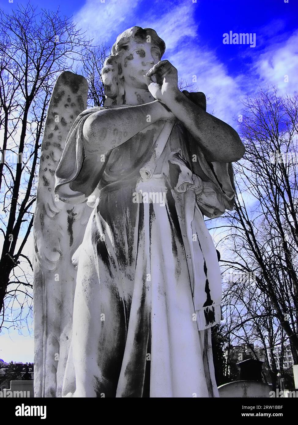 Angel guardian over the grave at the cemetery Stock Photo - Alamy