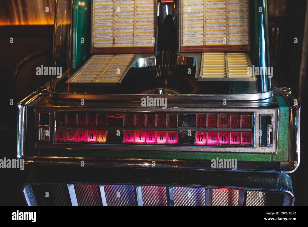 Vintage American music jukebox with illuminated buttons, process of ...