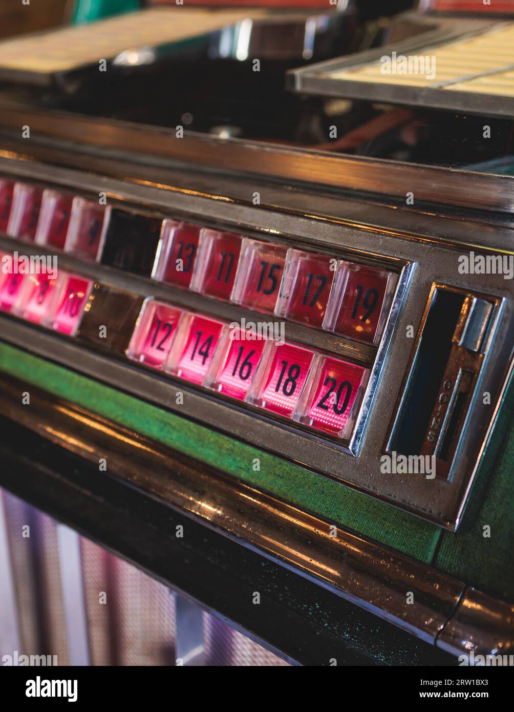 Vintage American music jukebox with illuminated buttons, process of ...