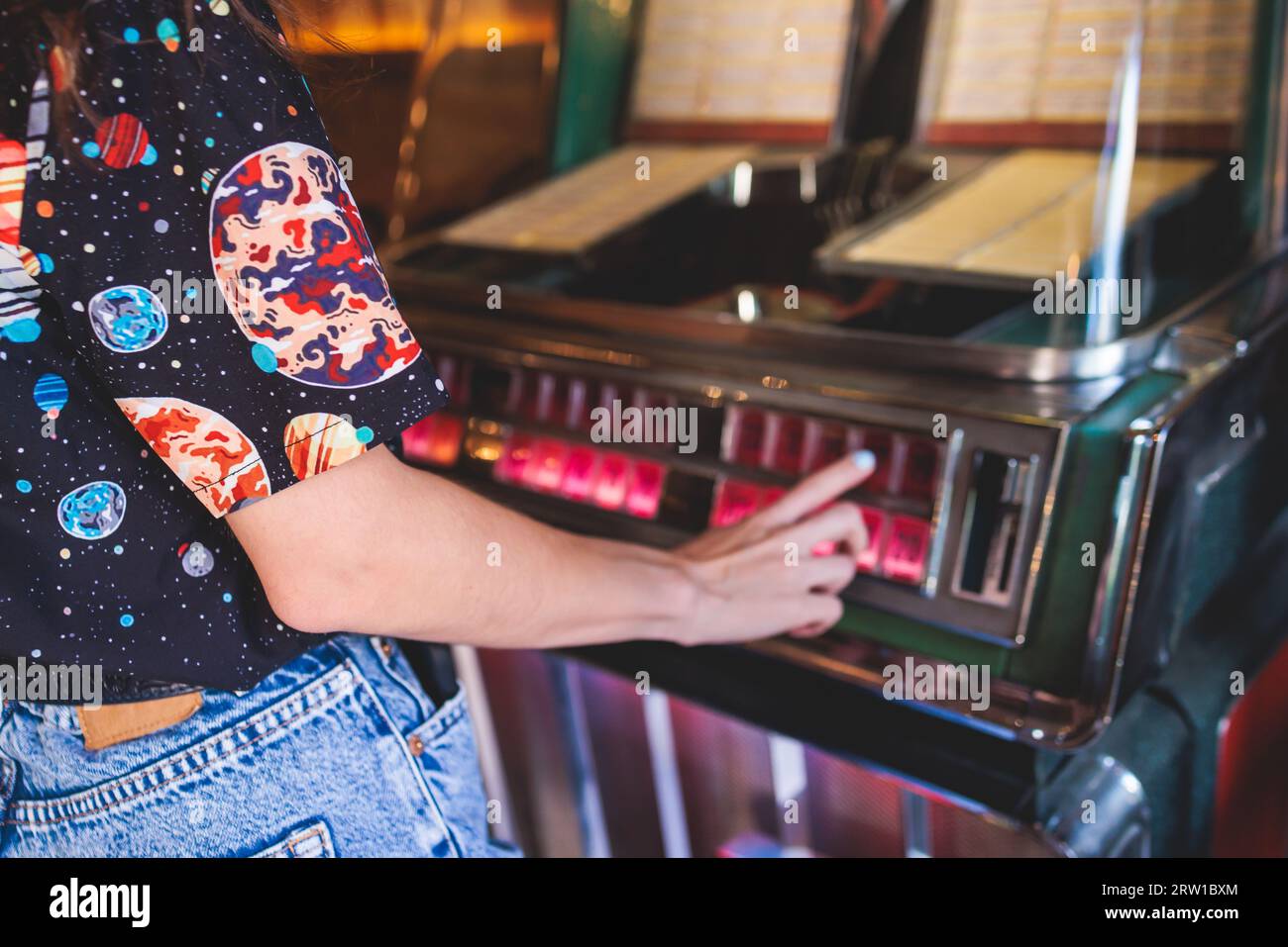 Vintage American music jukebox with illuminated buttons, process of ...