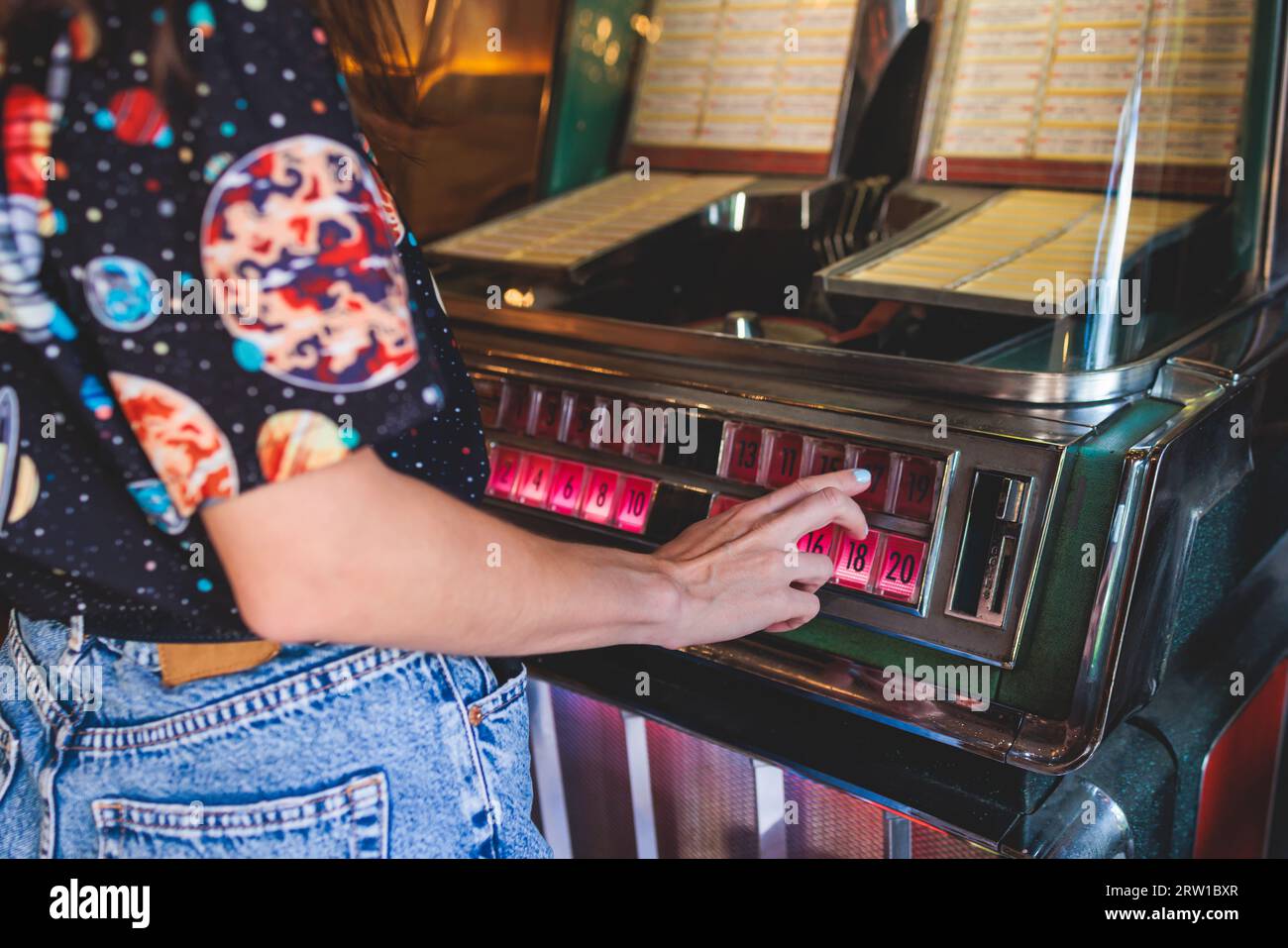 Vintage American music jukebox with illuminated buttons, process of ...