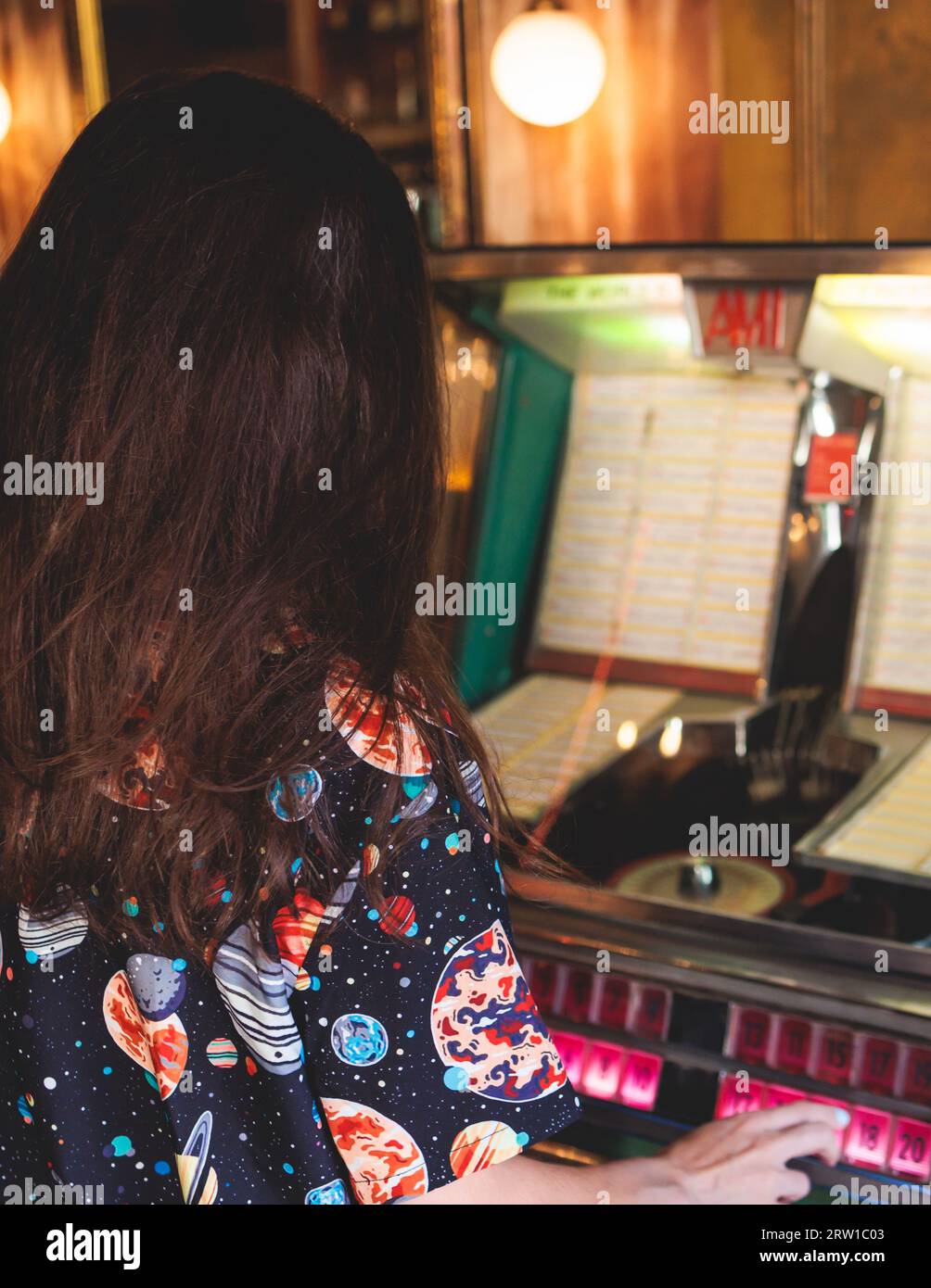 Vintage American music jukebox with illuminated buttons, process of ...