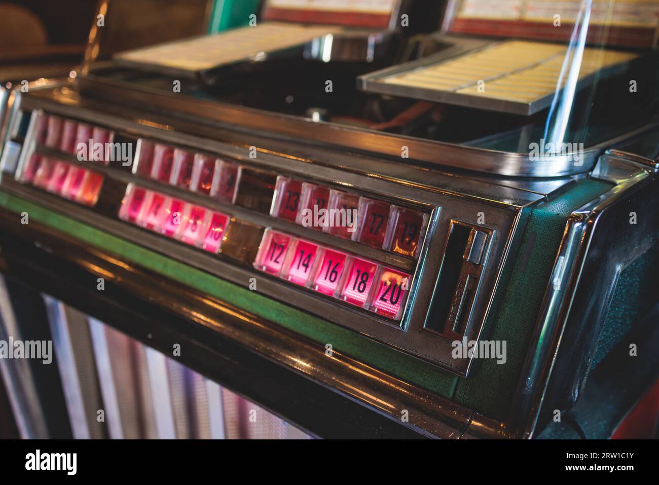 Vintage American music jukebox with illuminated buttons, process of ...