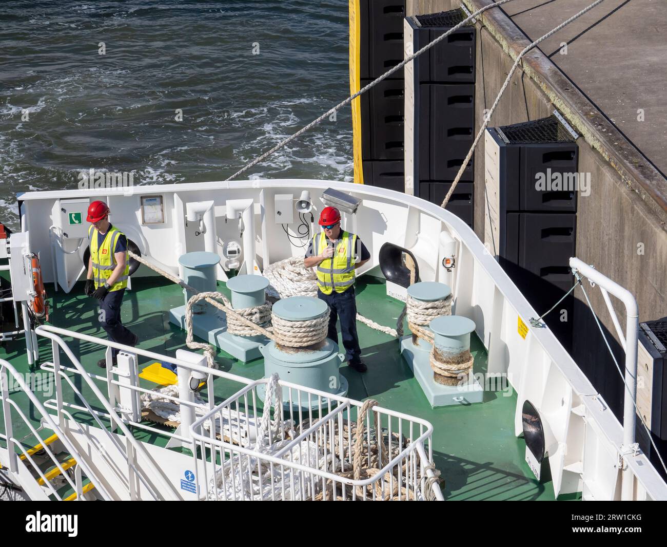 Workers on a ferry at Kennacraig in West Loch Tarbert, near Tarbert ...