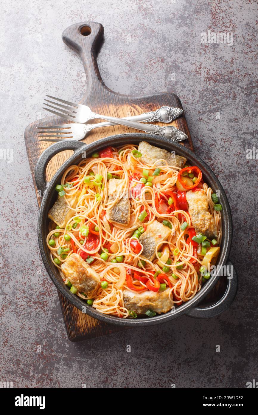Mediterranean food spaghetti with white sea fish, vegetables and tomato ...