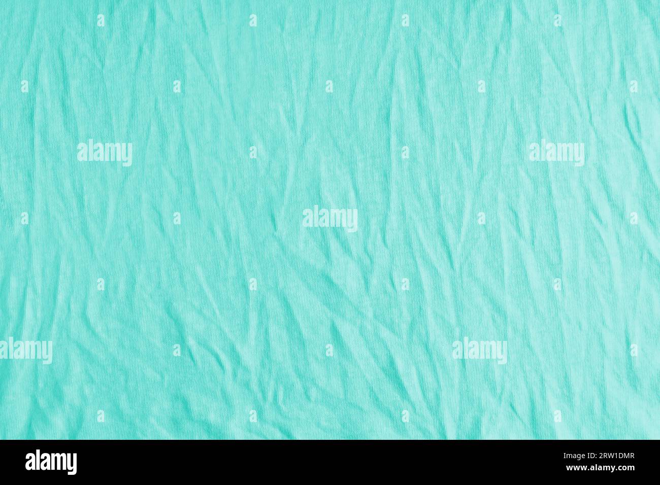 Wrinkled, crumpled turquoise fabric texture background. Wrinkled and ...