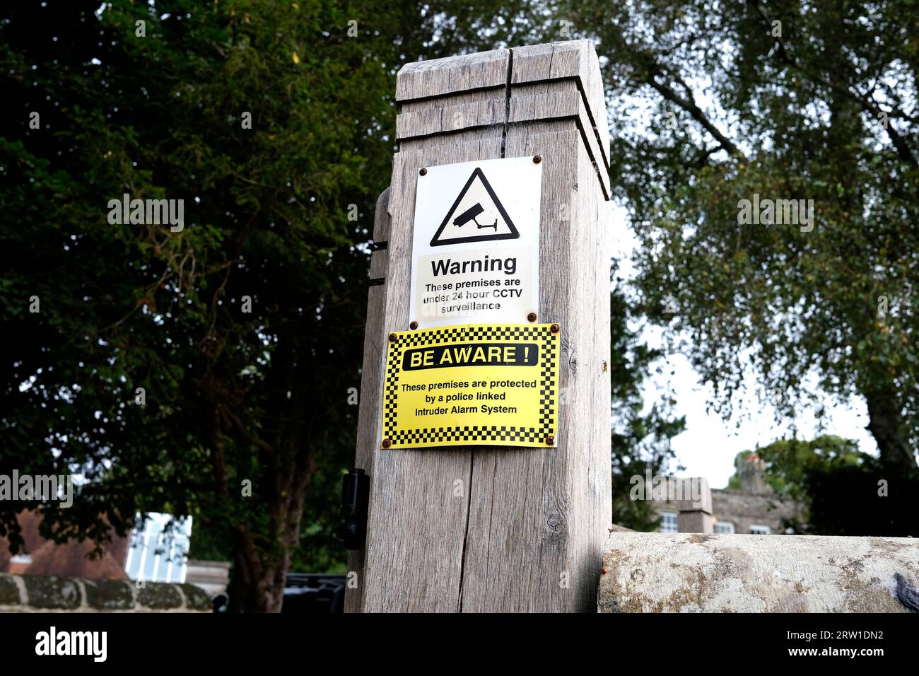 cctv 24 hour surveillance sign on a concrete column,pulborough,west ...