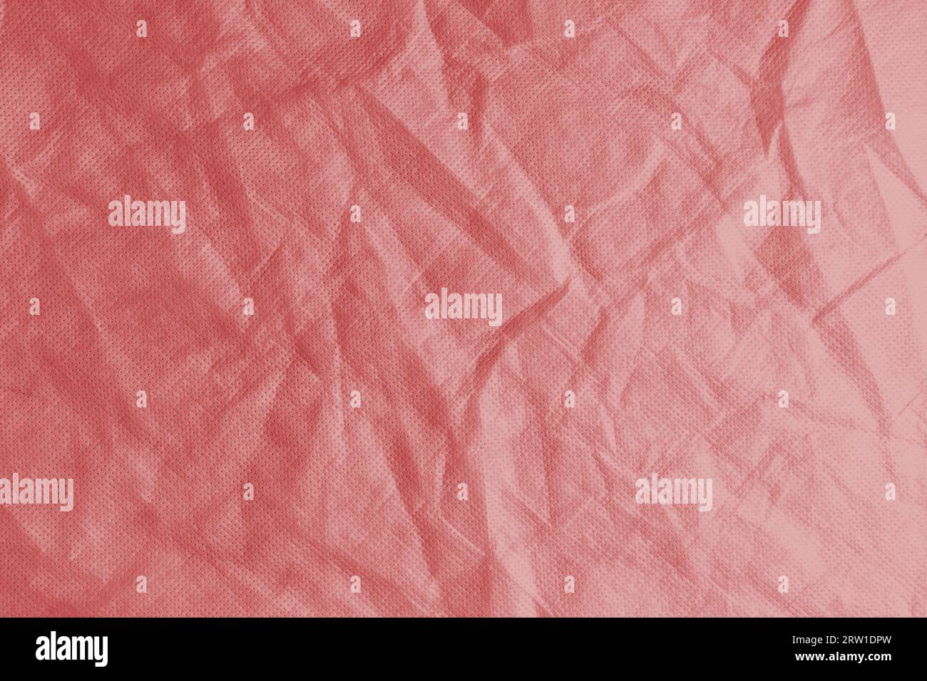 Wrinkled, crumpled red fabric texture background. Wrinkled and creased ...