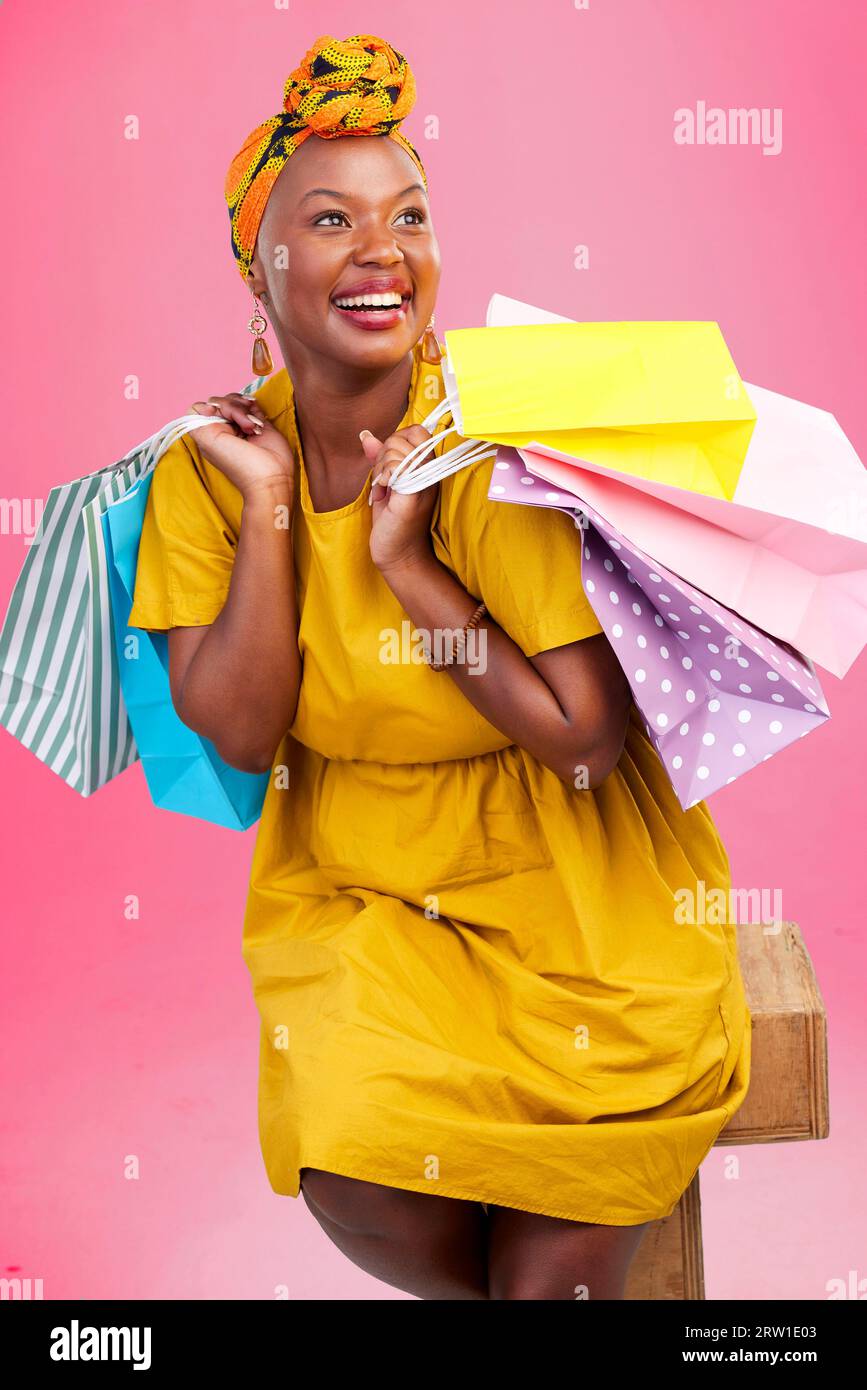 Shopping, thinking and black woman with bags, luxury items and fashion ...