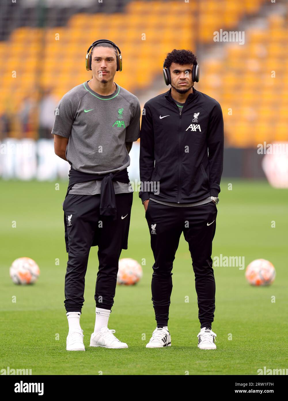 Liverpool's Darwin Nunez and Luis Diaz (right) inspect the pitch ahead ...