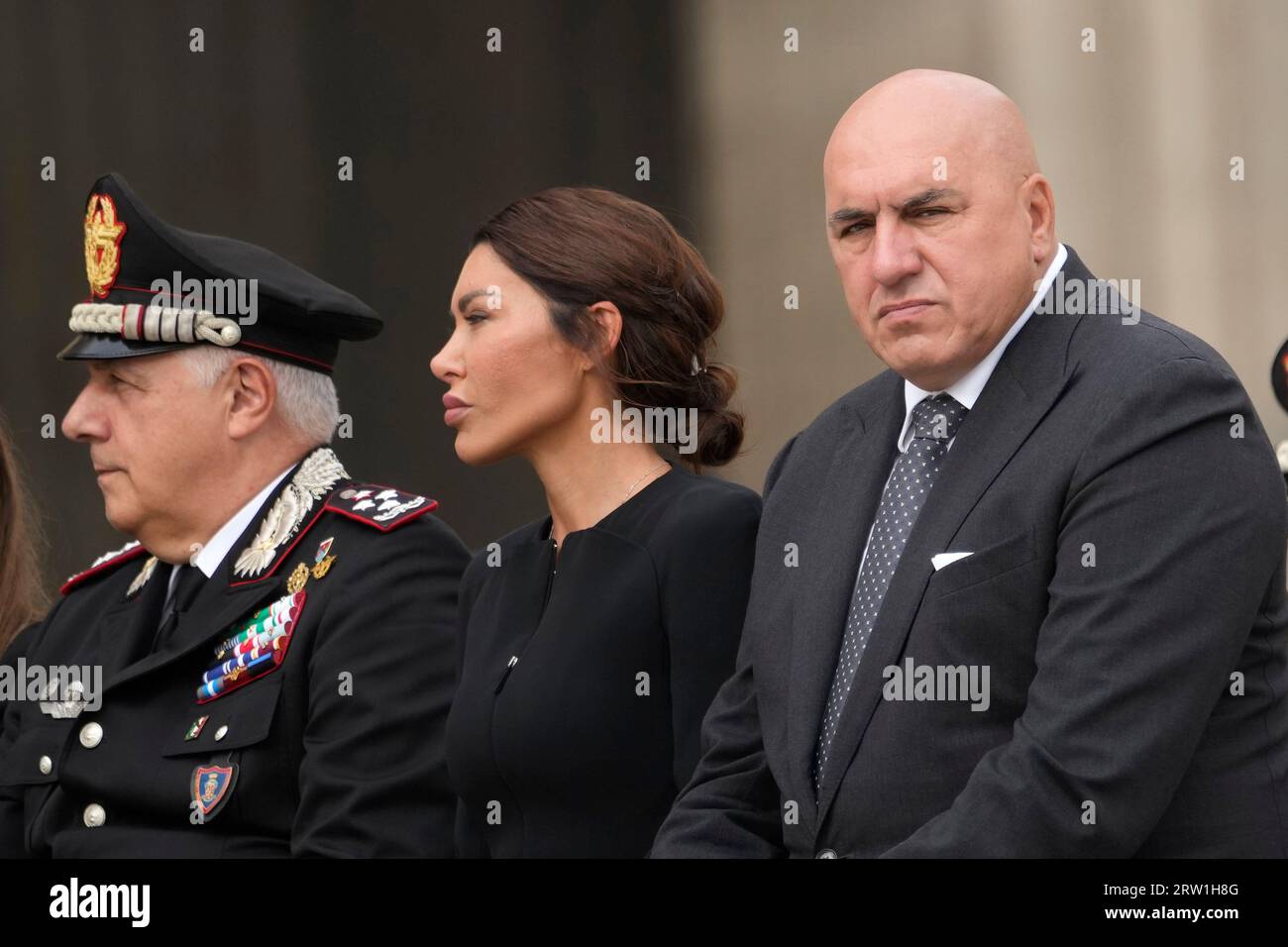 Italy's defence minister Guido Crosetto, right, is flanked by his wife ...