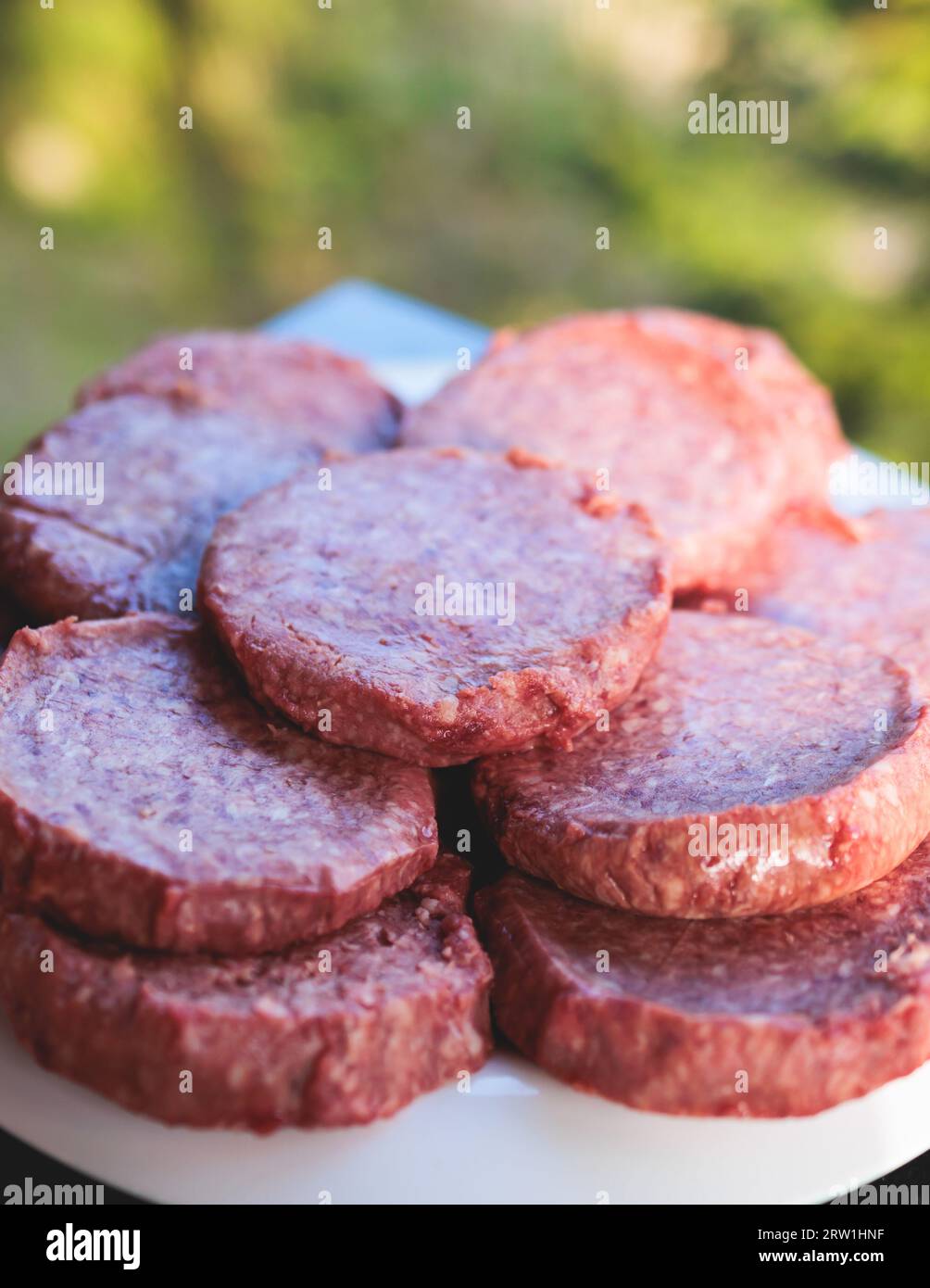 Process of cooking and grilling beef burgers on open-air street food ...