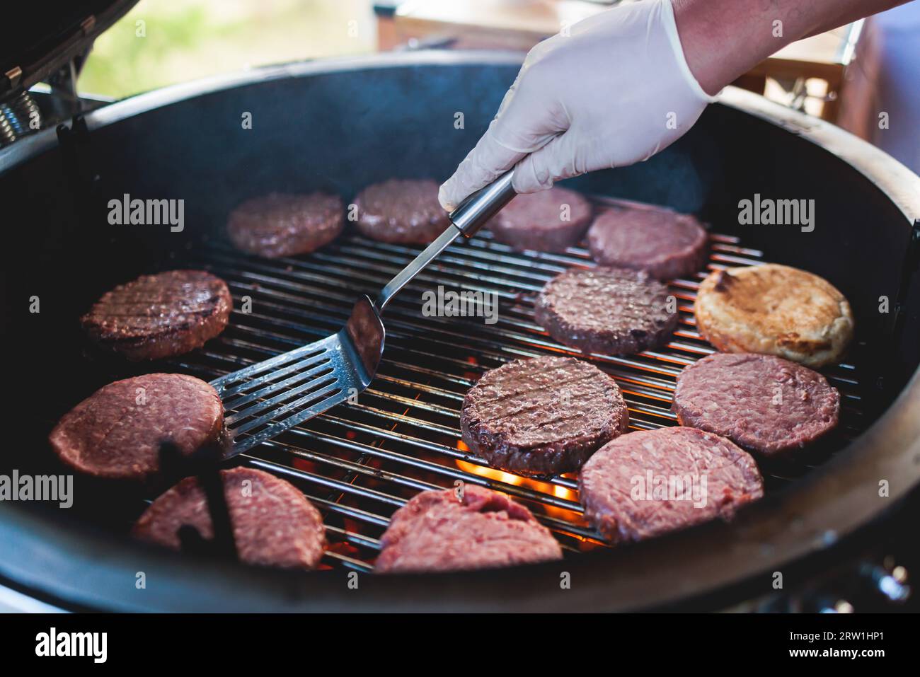 Hamburgers on gas grill hi-res stock photography and images - Alamy