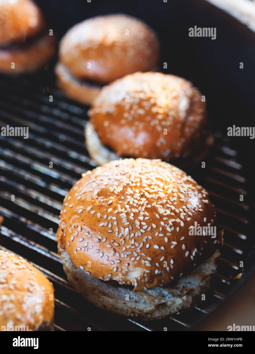 Hamburgers on gas grill hi-res stock photography and images - Alamy