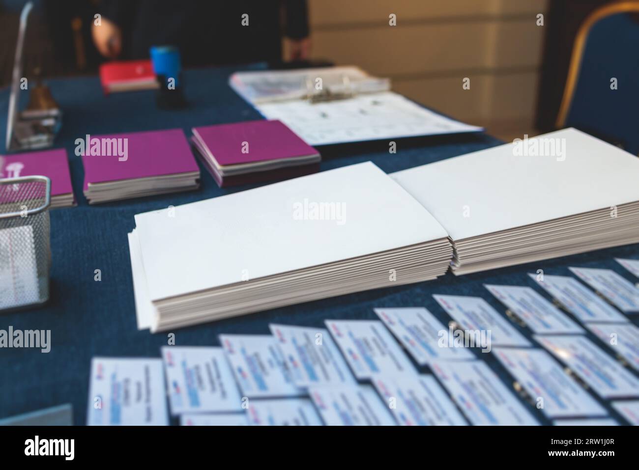 Registration desk table, process of checking in on a conference ...