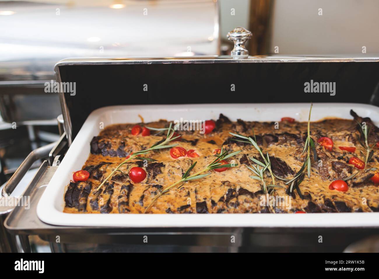 Beautifully decorated catering banquet table with different main course ...