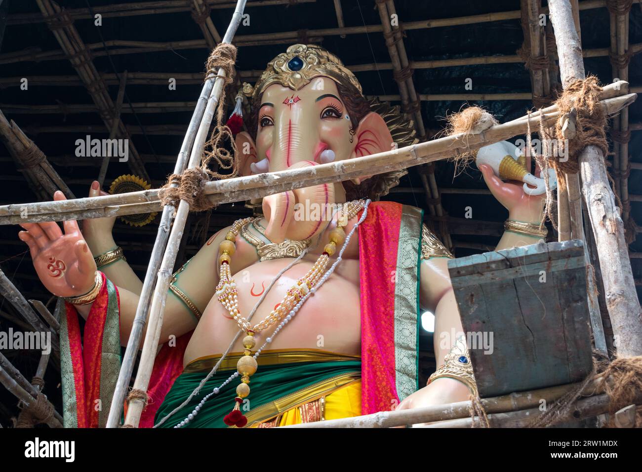A beautiful idol of Lord Ganpati being displayed in a procession called ...