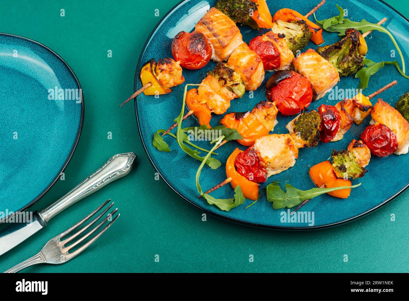 Grilled salmon fish kebab skewers with vegetables Stock Photo - Alamy