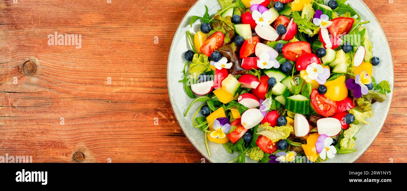 Vegetable salad with edible flowers. Copy space, recipe place Stock ...