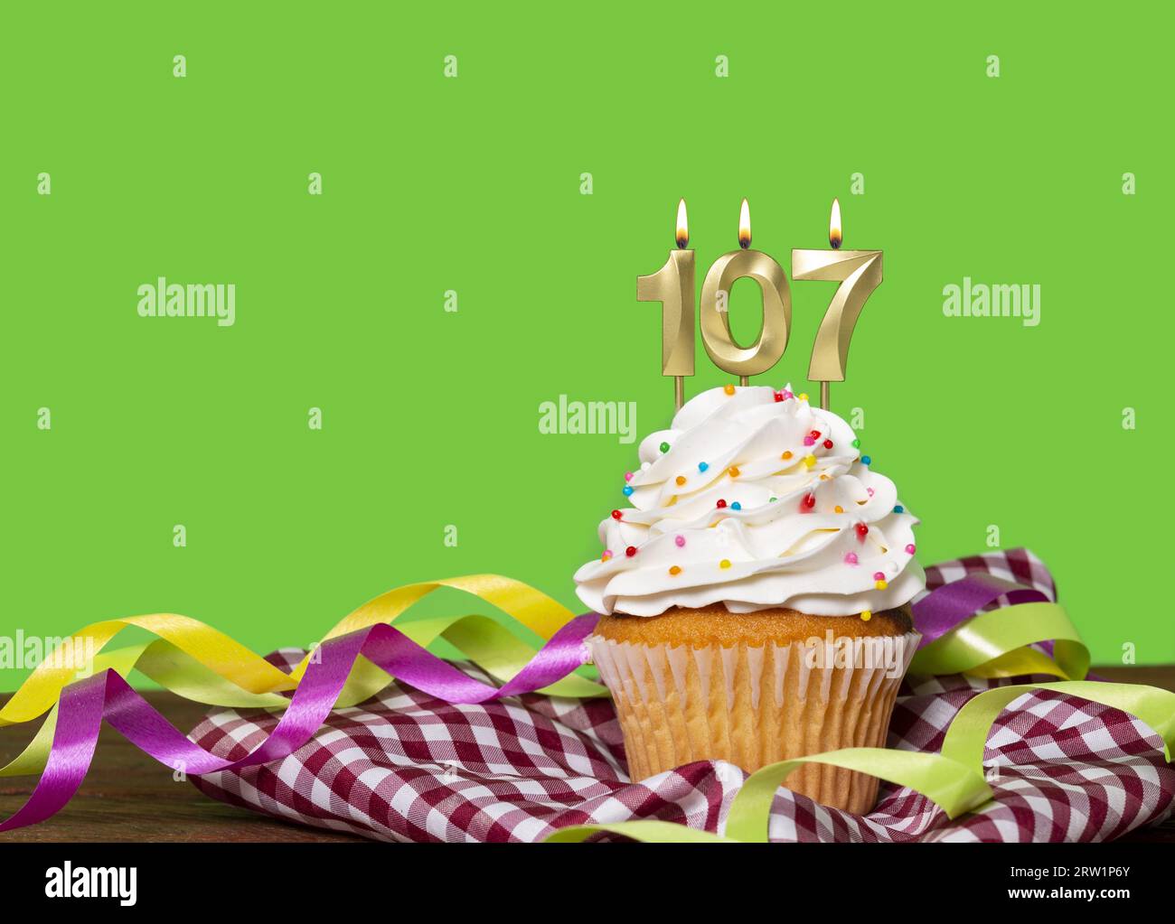 Birthday Cake With Candle Number 107 - On Green Background Stock Photo ...