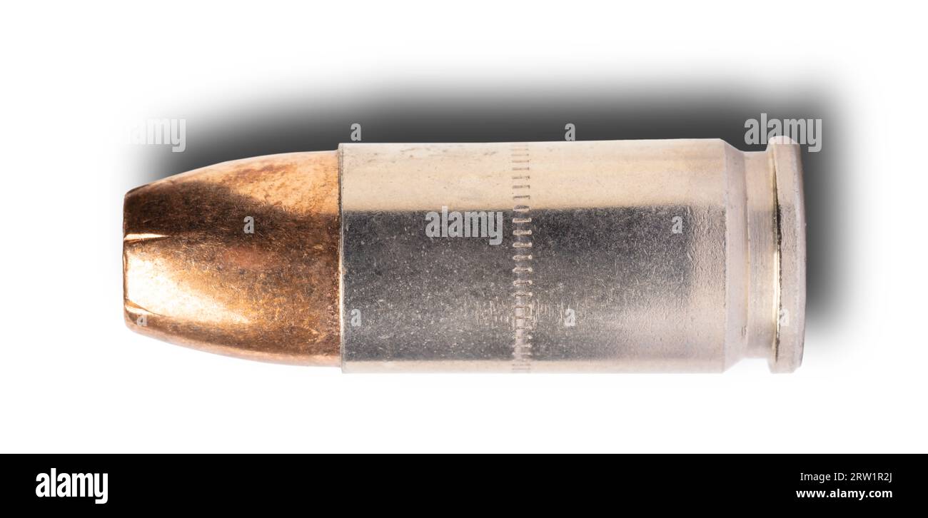 Hollow point bullet on 9 mm ammo with shadow above and behind the ...