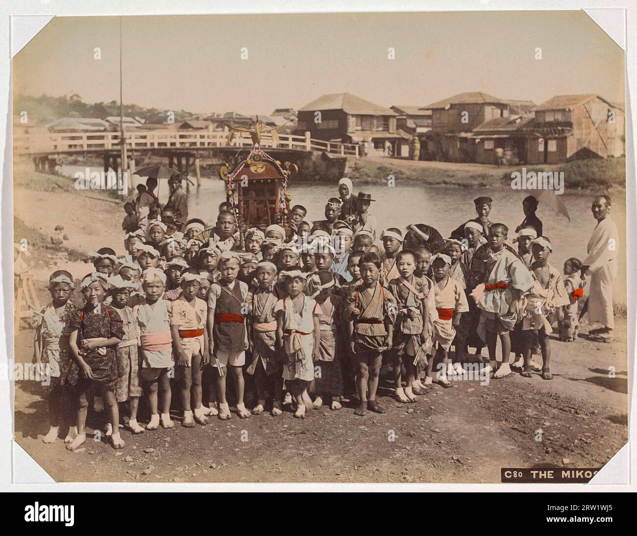 Children with a ceremonial carriage on the bank of a river, anonymous ...
