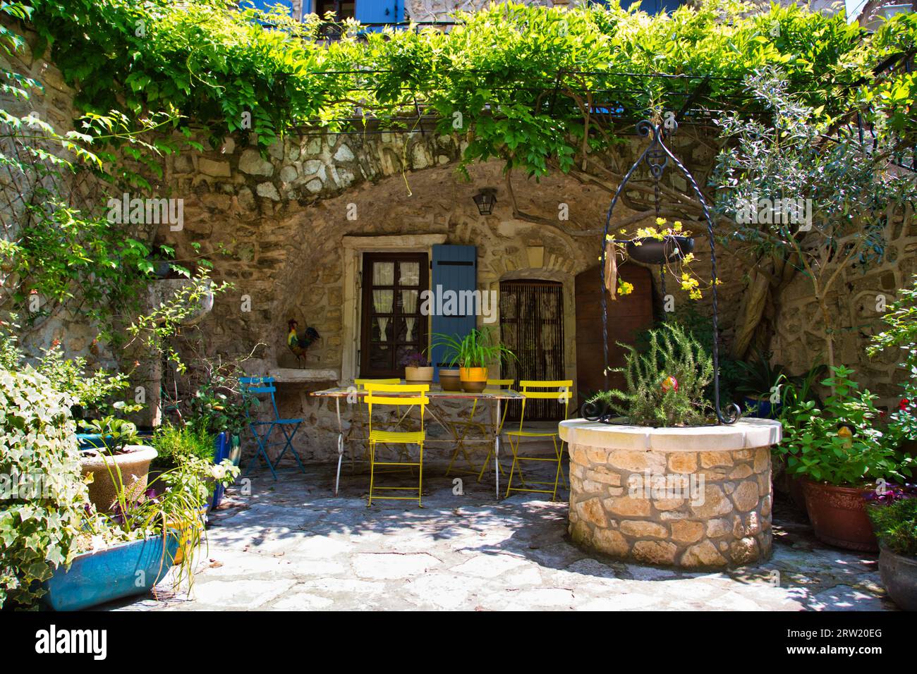 Beautiful overgrown terrace of an old stone house in Aiguèze (France ...