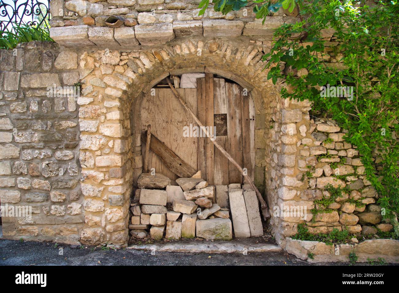 a blocked entrance of a stone house. photographed in aiguèze Stock ...