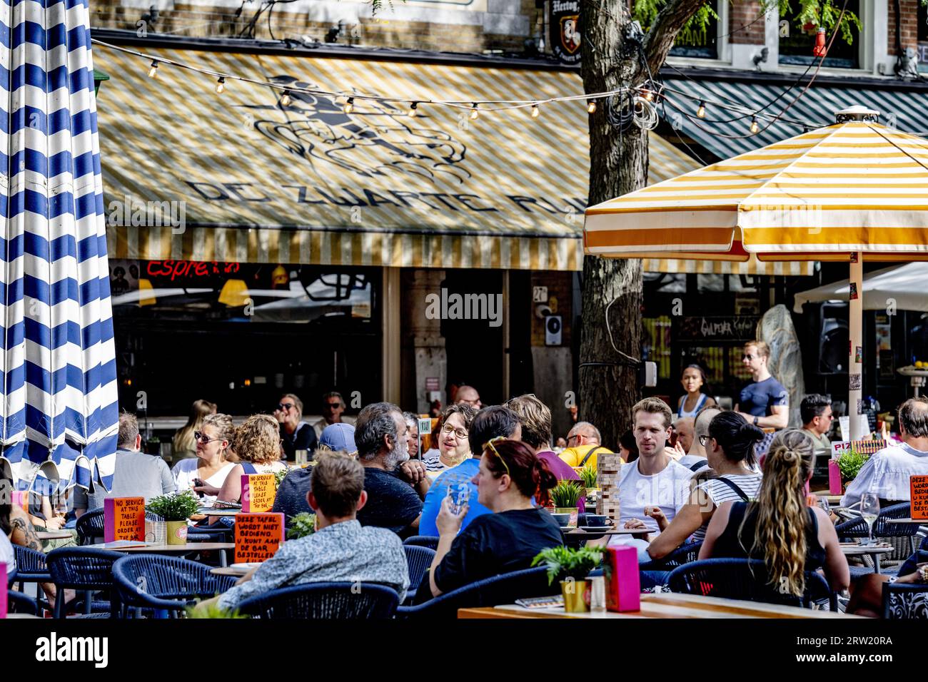 THE HAGUE - People enjoy the last of the beautiful summer weather on a ...
