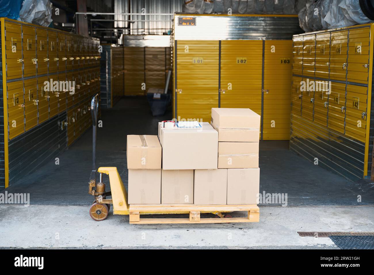 Loaded cargo trolley in a warehouse Stock Photo - Alamy