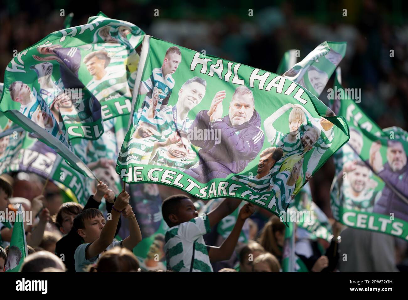 Celtic fans wave flags in the stands before the cinch Premiership match ...