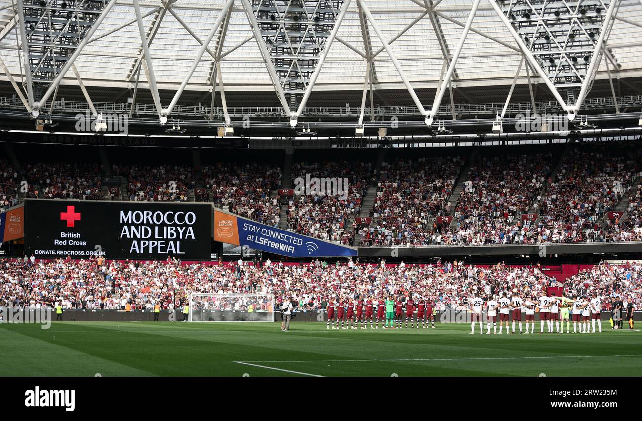 The players, officials and fans observe a minutes silence for victims ...