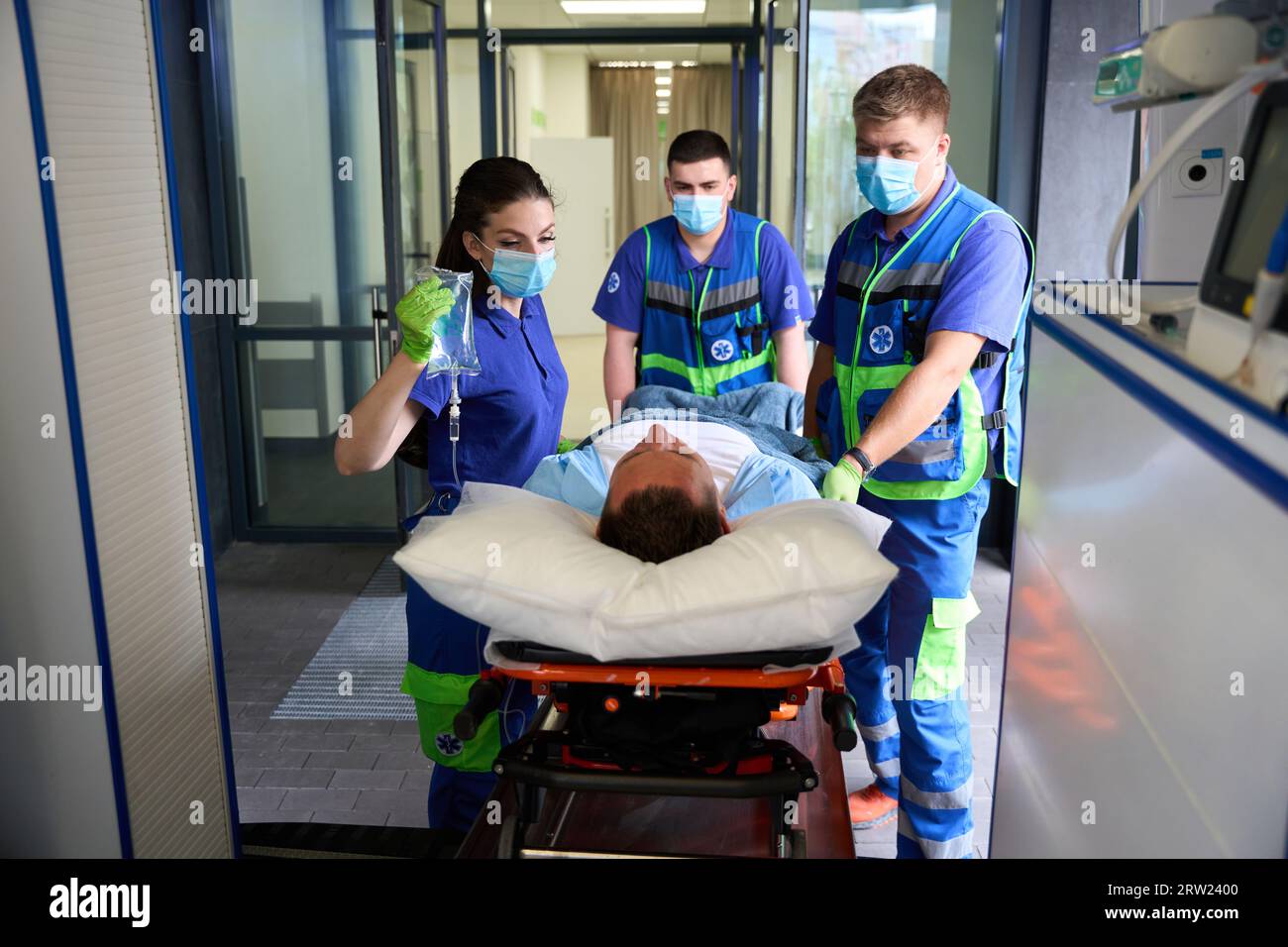 Team of paramedics brought the man to the emergency room Stock Photo ...