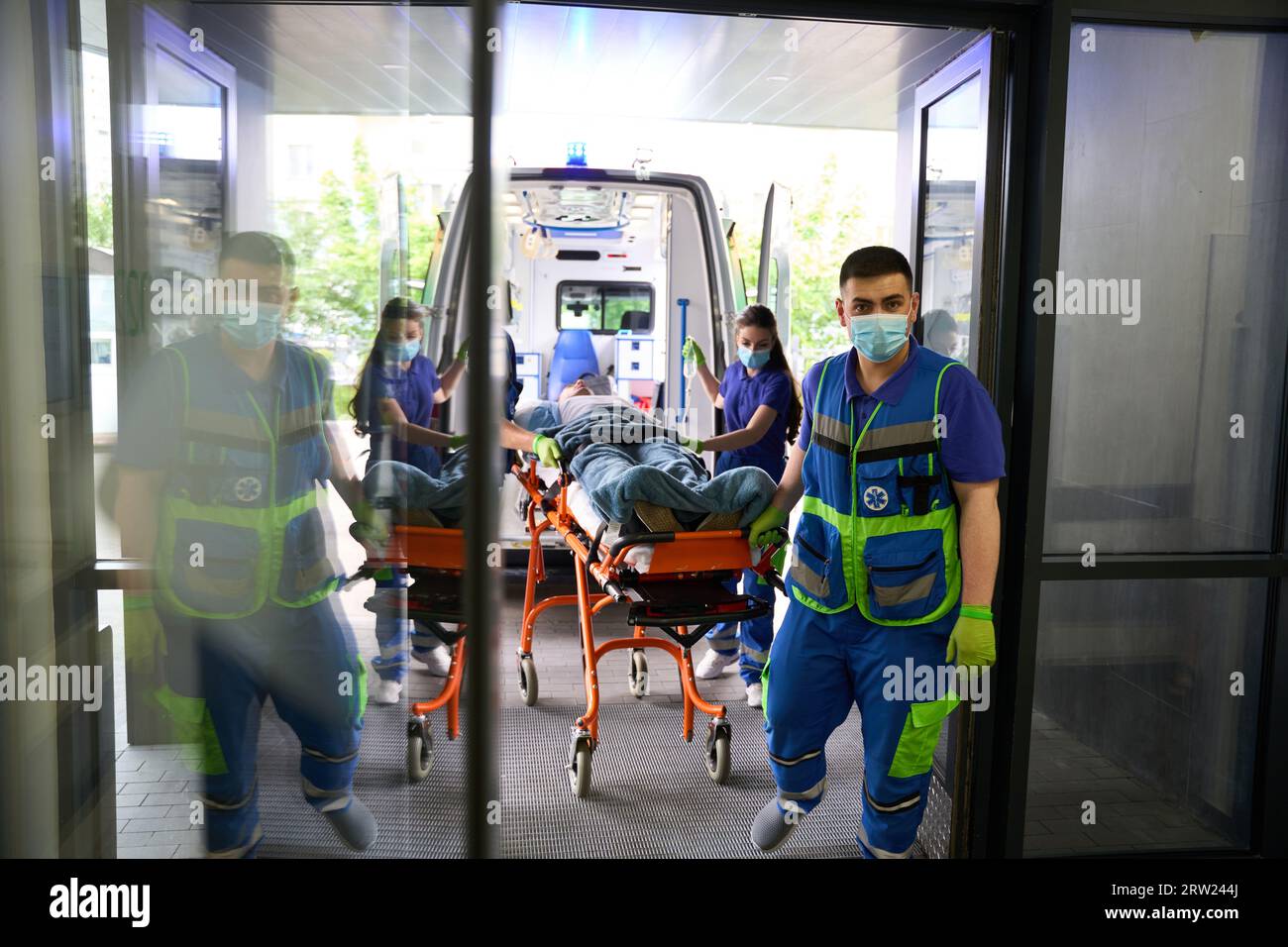 Ambulance team took the patient to the hospital Stock Photo - Alamy
