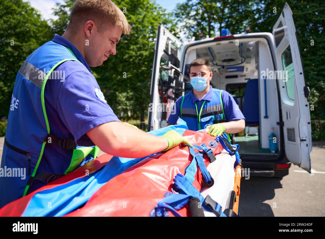 Doctors fix the victim in the accident on special stretcher Stock Photo ...