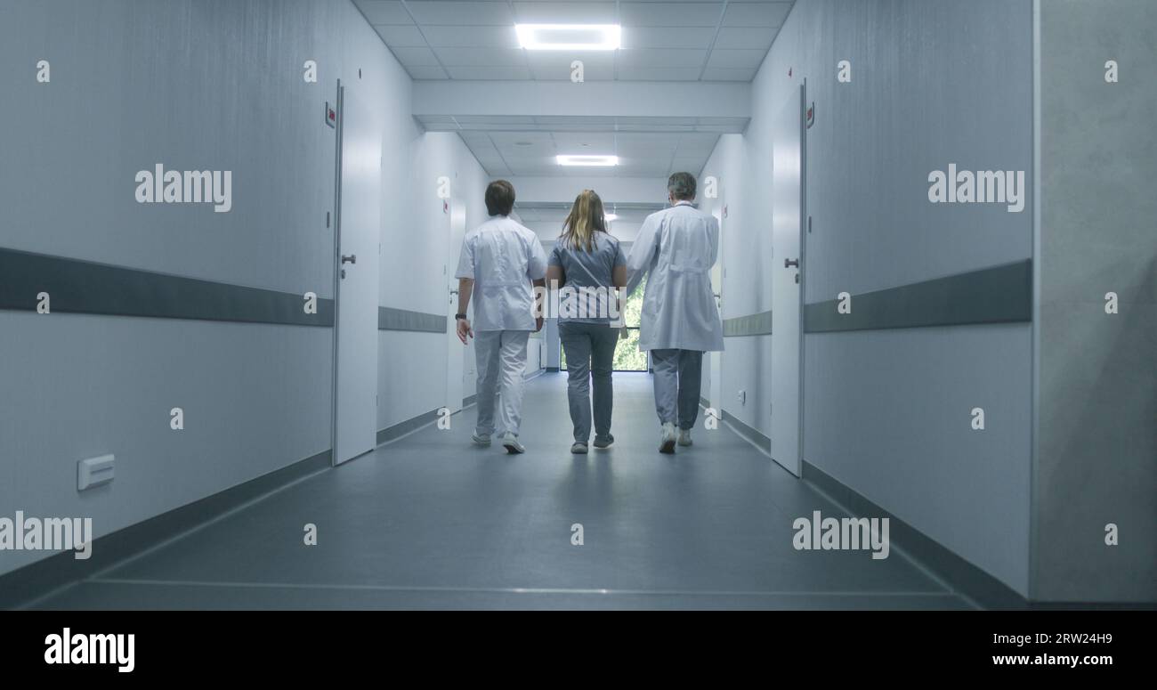 Nurse walking corridor back hi-res stock photography and images - Alamy