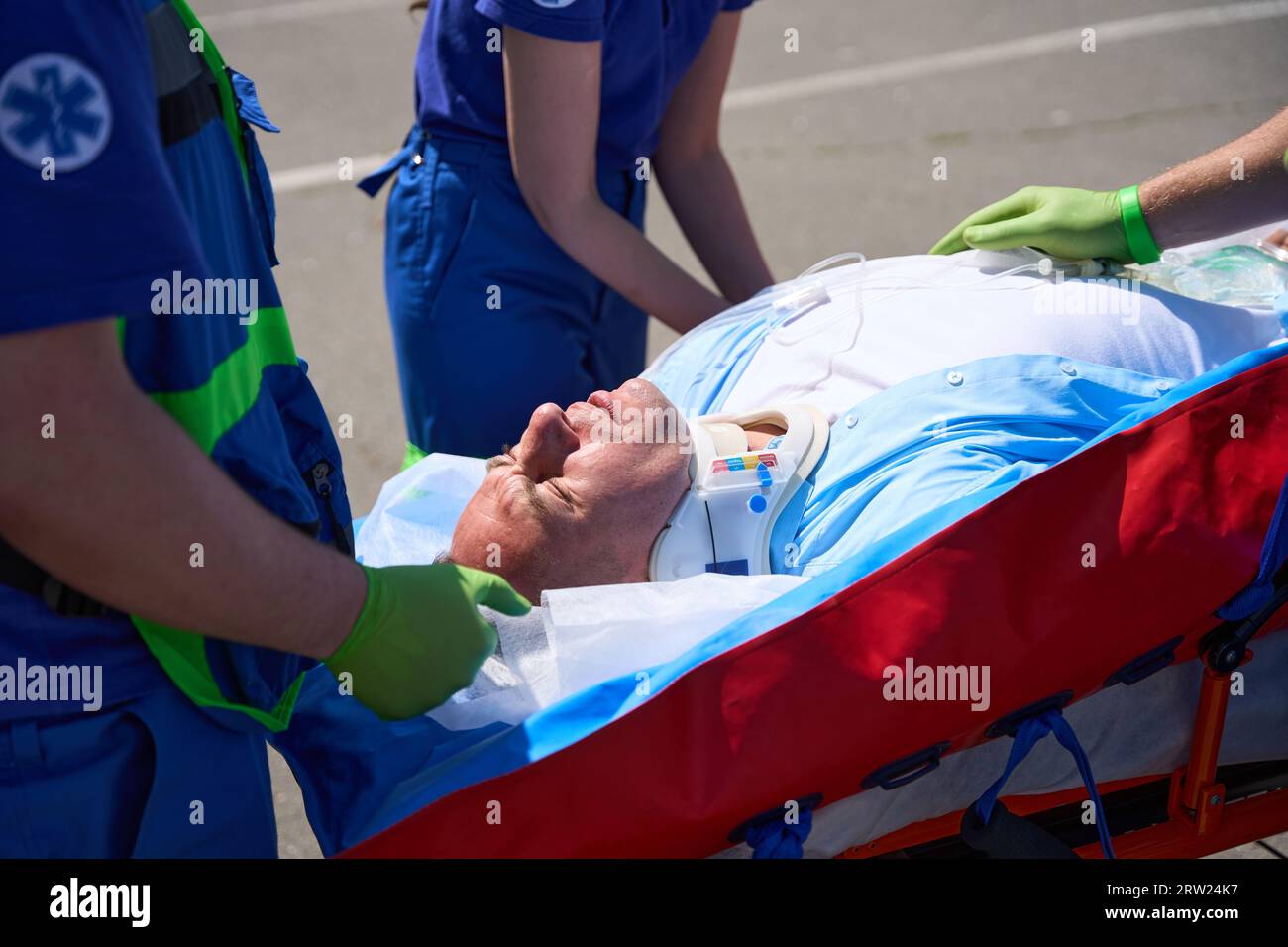 Ambulance team laid the patient for transportation on vacuum mattress ...